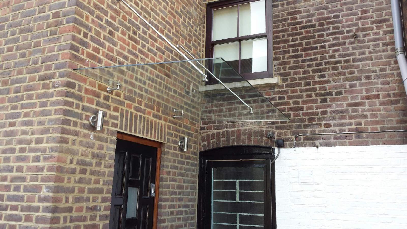 Frameless glass canopy